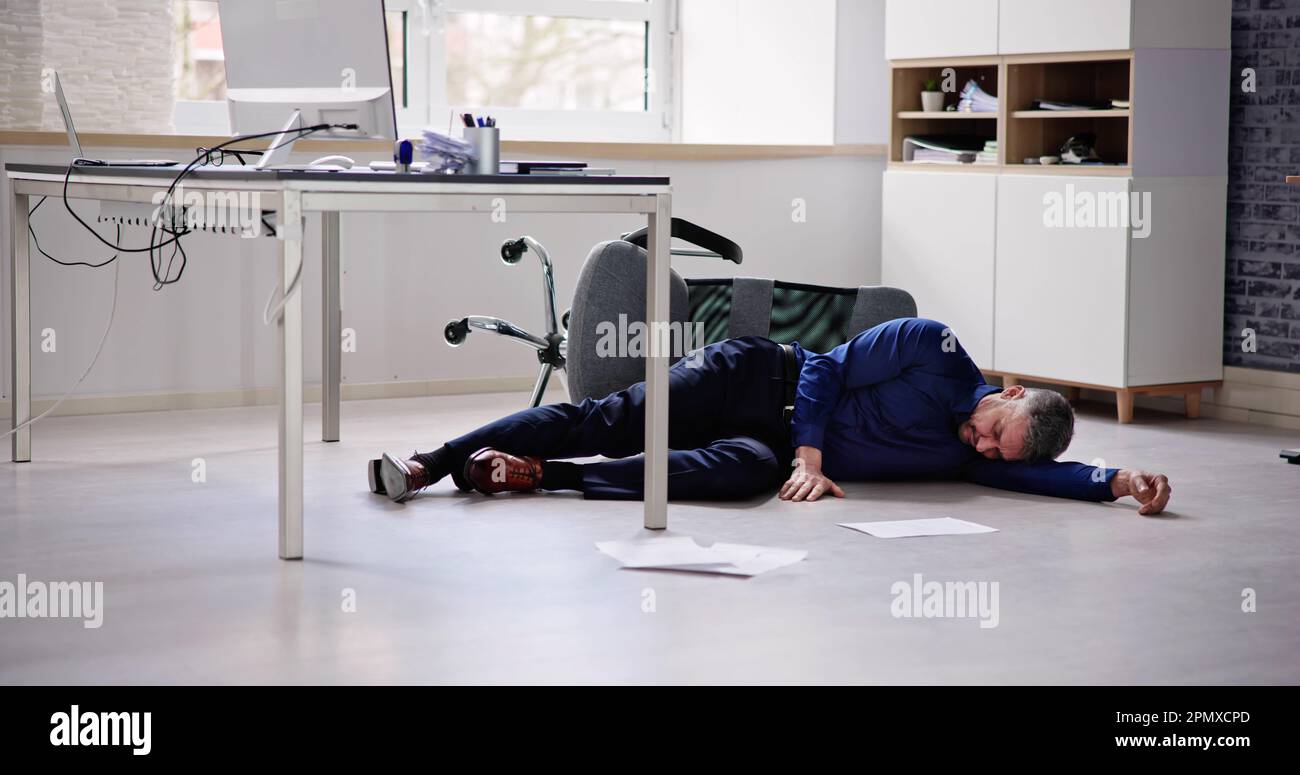 Faint Accident In Office. Fall From Chair At Workplace Stock Photo - Alamy