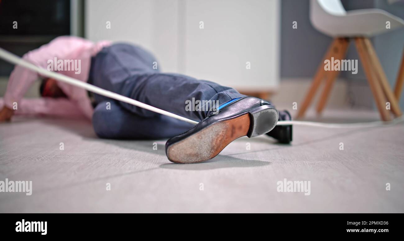 Wire Cord Trip Over And Fall. Feet Stumble On Cable Stock Photo - Alamy