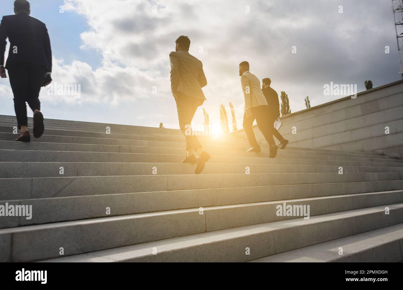 Business people climb the steps of the city stairs. impersonal rising ...