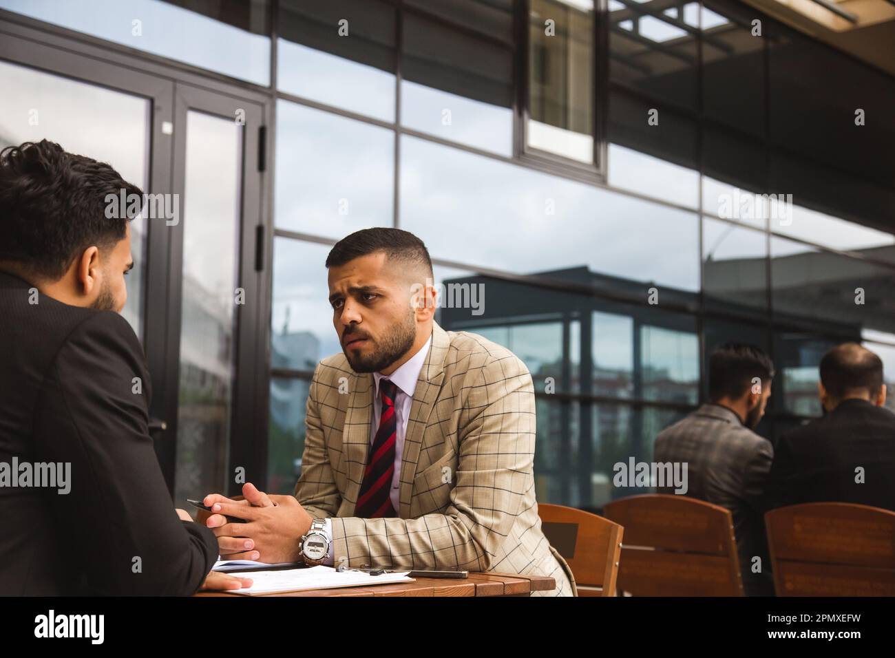 Business people outdoors. Employee meeting. Conversation and ...
