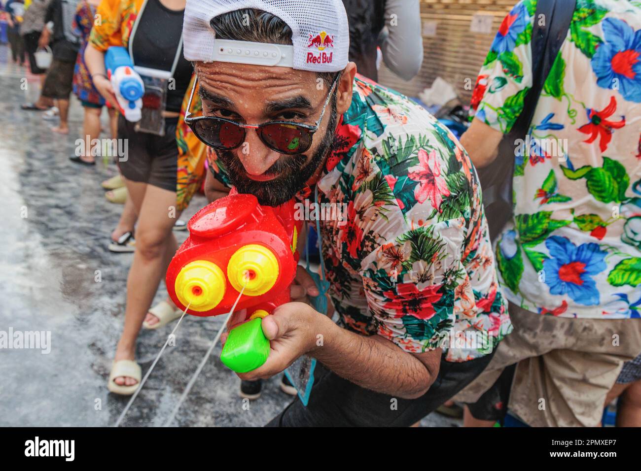 Bangkok, Thailand. 15th Apr, 2023. A tourist seen shooting a water gun ...