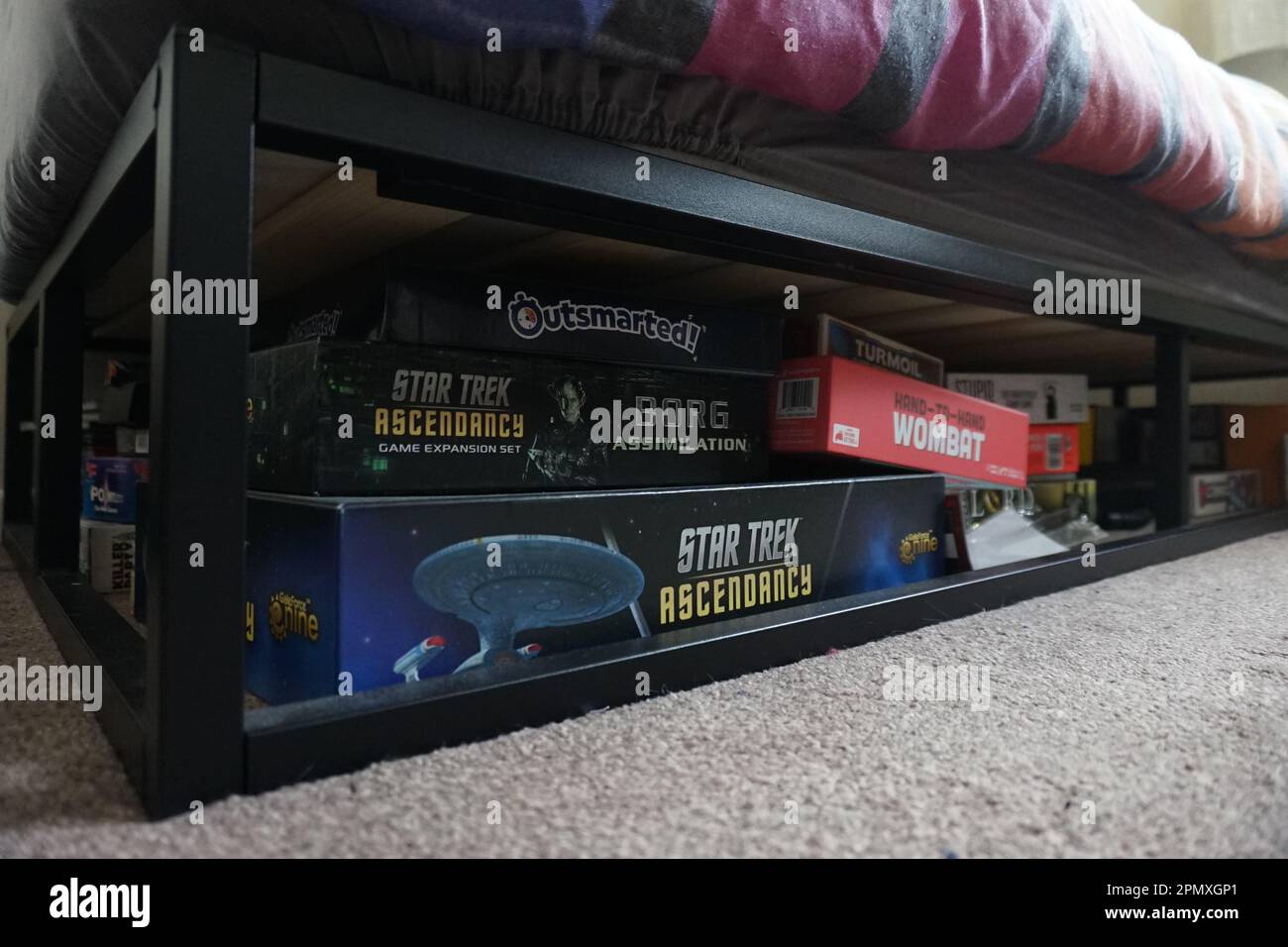 Makeshift storage space under the bed for board game collection ...