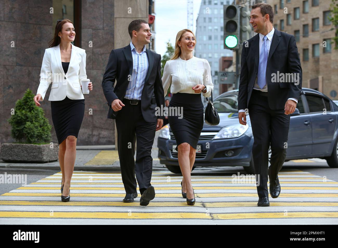 A group of office employees spend time outside at lunchtime Stock Photo ...