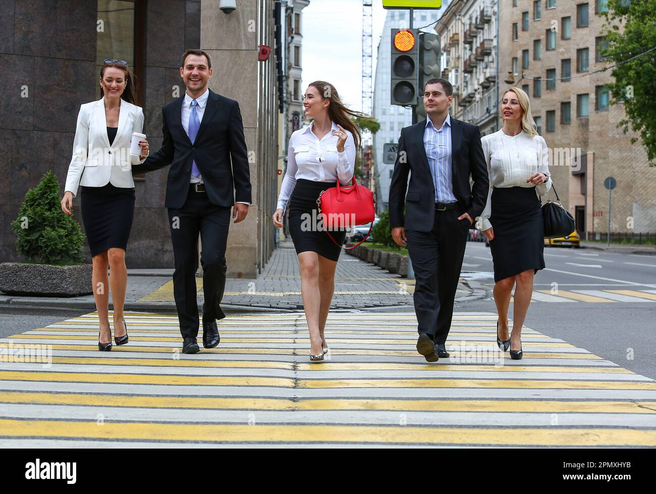 A group of office employees spend time outside at lunchtime Stock Photo ...