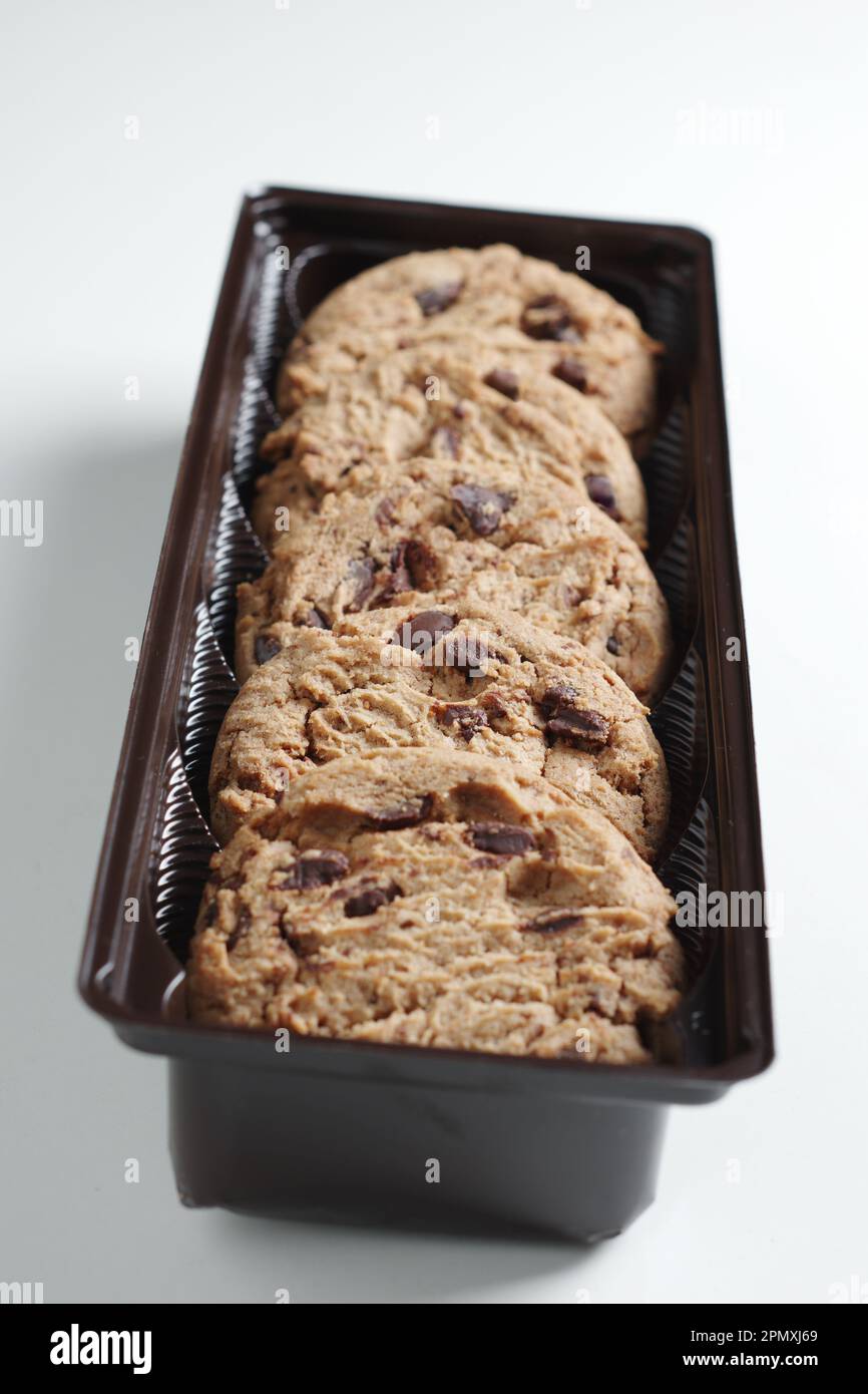 Chocolate chip cookies in plastic packaging on a white background ...