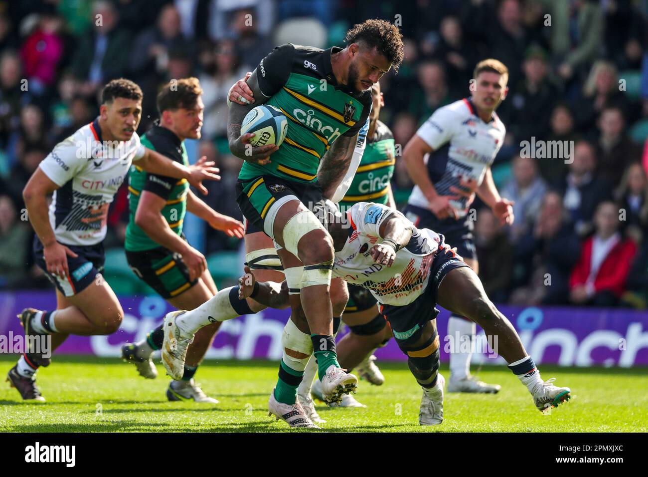 Northampton's Courtney Lawes is tackled by Saracens' Nick Isiekwe and ...