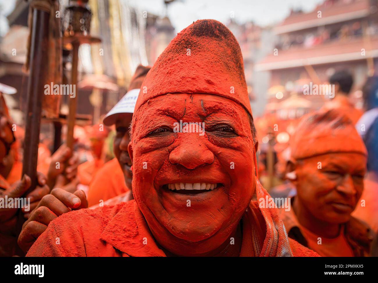 Kathmandu, Nepal. 15th Apr, 2023. A reveler reacts as his face is ...