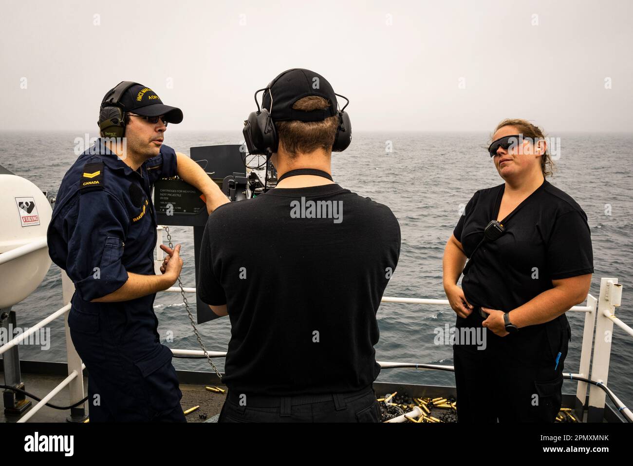 Crew members onboard HMCS Margaret Brooke training at firing a 0.50 ...