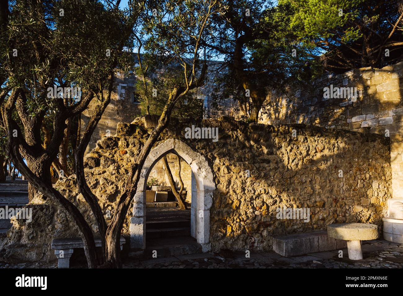 Brick wall and columns as part of the Saint George's Castle in Lisbon ...