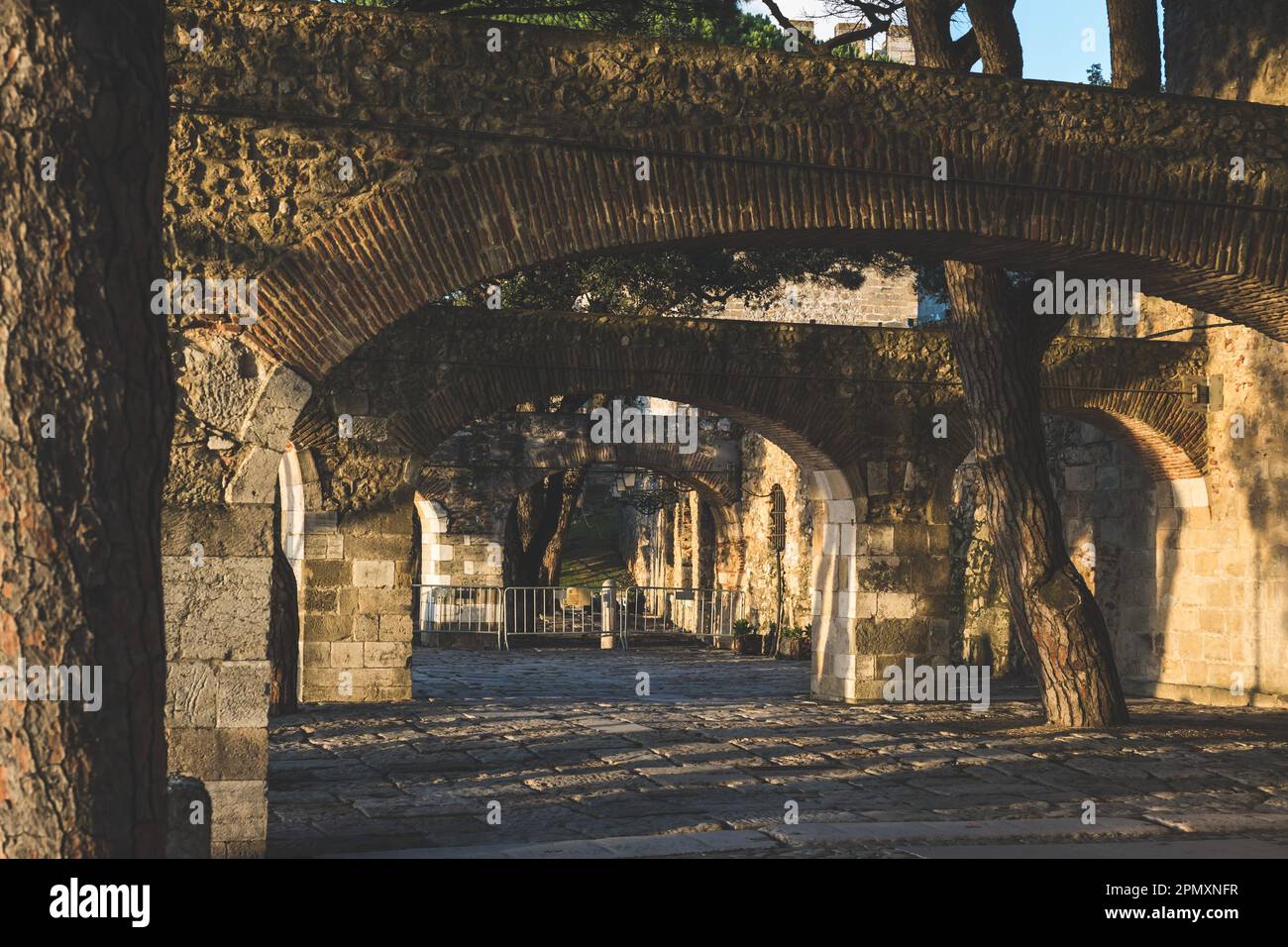 Brick wall and columns as part of the Saint George's Castle in Lisbon ...