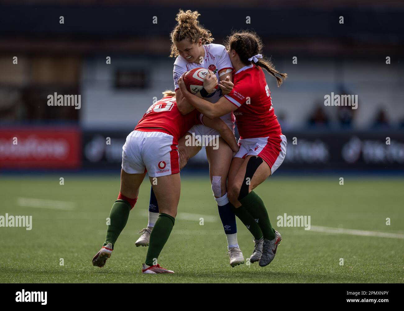 England's Ellie Kildunne is tackled by Wales Hannah Jones (left) and ...
