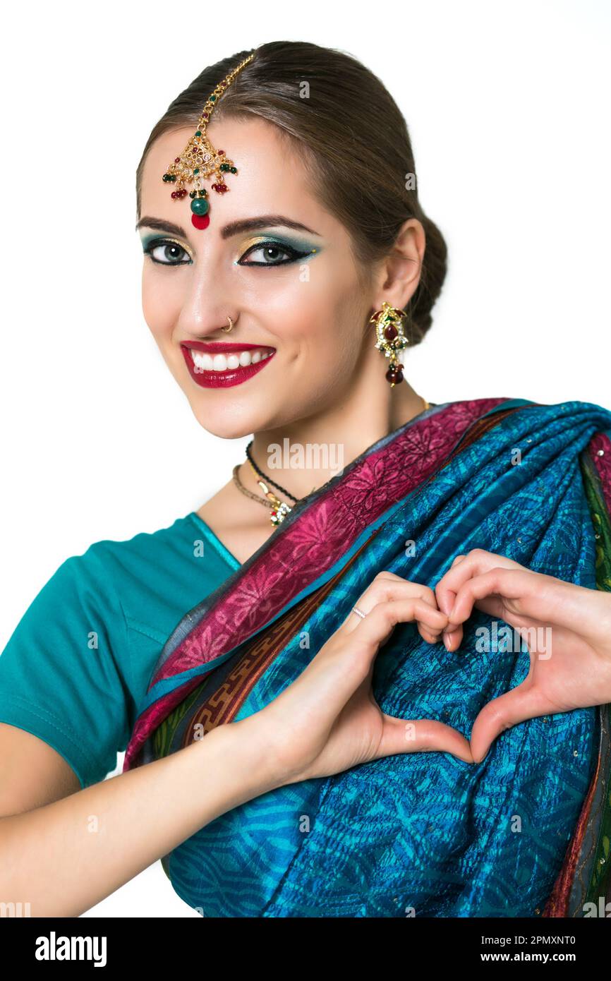 A girl in an Indian sari poses in the studio Stock Photo - Alamy