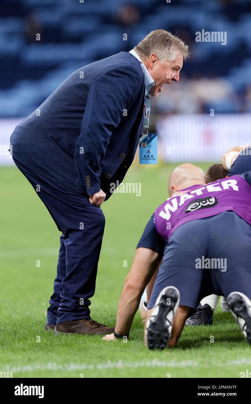 Waratahs General Manager, Andrew Blades assists in the scrum warm up ...