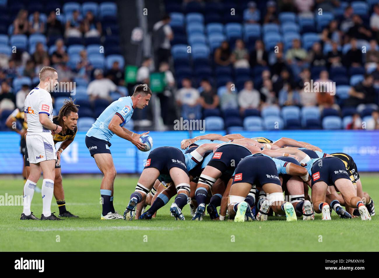 Jake Gordon of the Waratahs prepares to feed the ball in the scrum ...