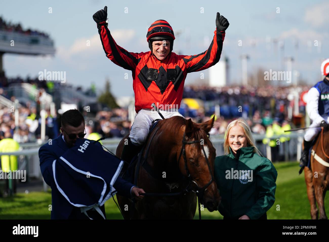 Jockey Harry Skelton celebrates after winning the William Hill Handicap ...