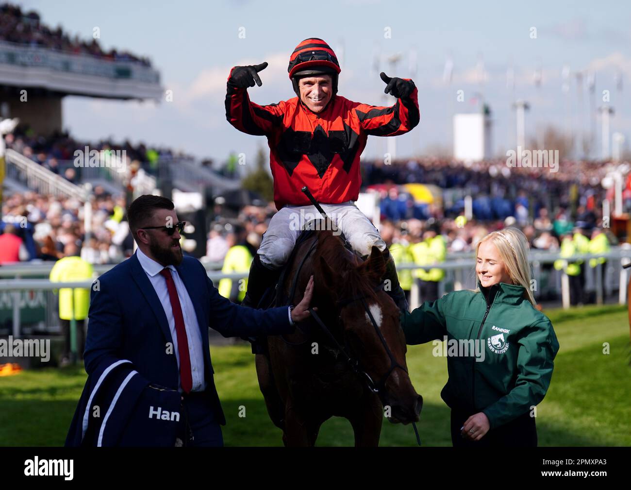 Jockey Harry Skelton celebrates after winning the William Hill Handicap ...