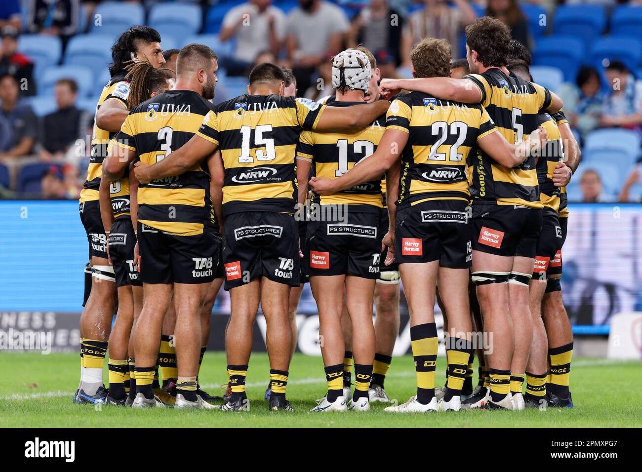 The Western Force players huddle during the Super Rugby Pacific match ...