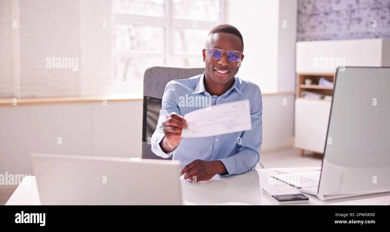 Holding Paycheck Or Payroll Check Or Insurance Cheque In Hand Stock ...