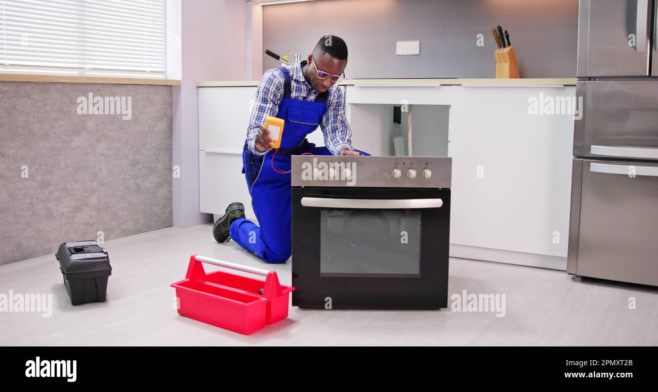 Man crouch kitchen hi-res stock photography and images - Alamy