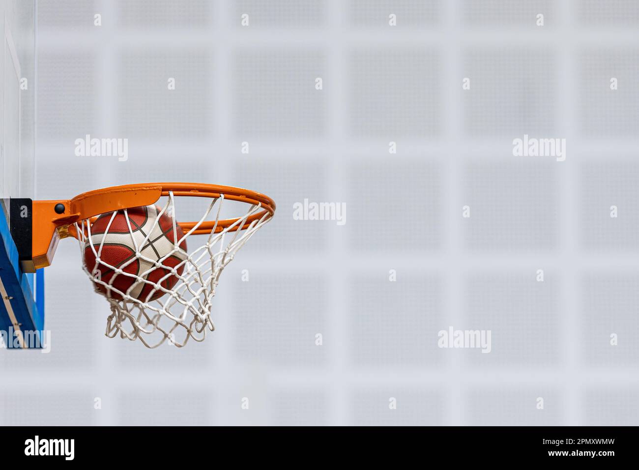 Basketball Ball On Wooden Sports Court. Junior Level Basketball Players ...