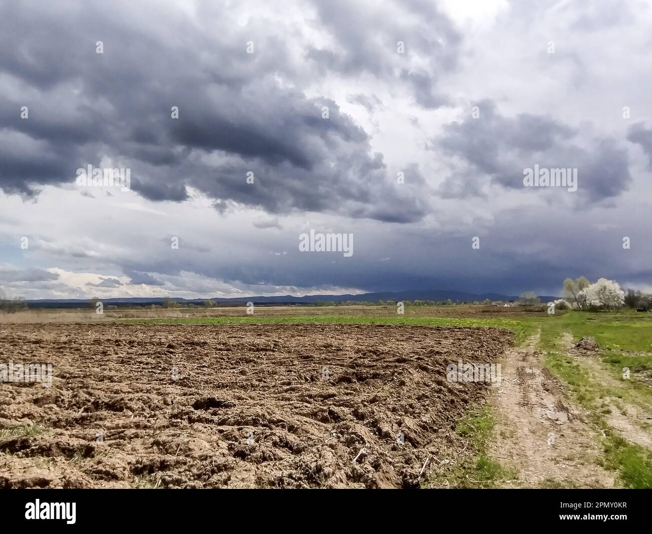 Cloudy sky in the distance. Spring landscape in Romania Stock Photo - Alamy