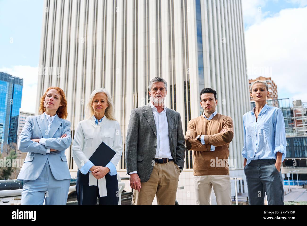Business people standing proud and looking at camera Stock Photo - Alamy