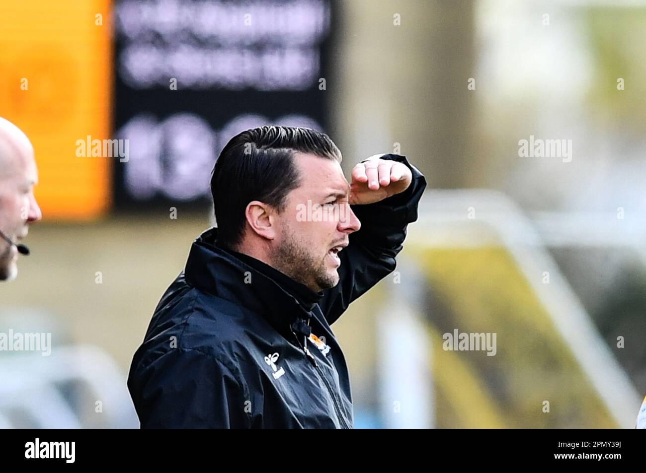 Mark Bonner (Manager Cambridge United) shades his eyes during the Sky ...