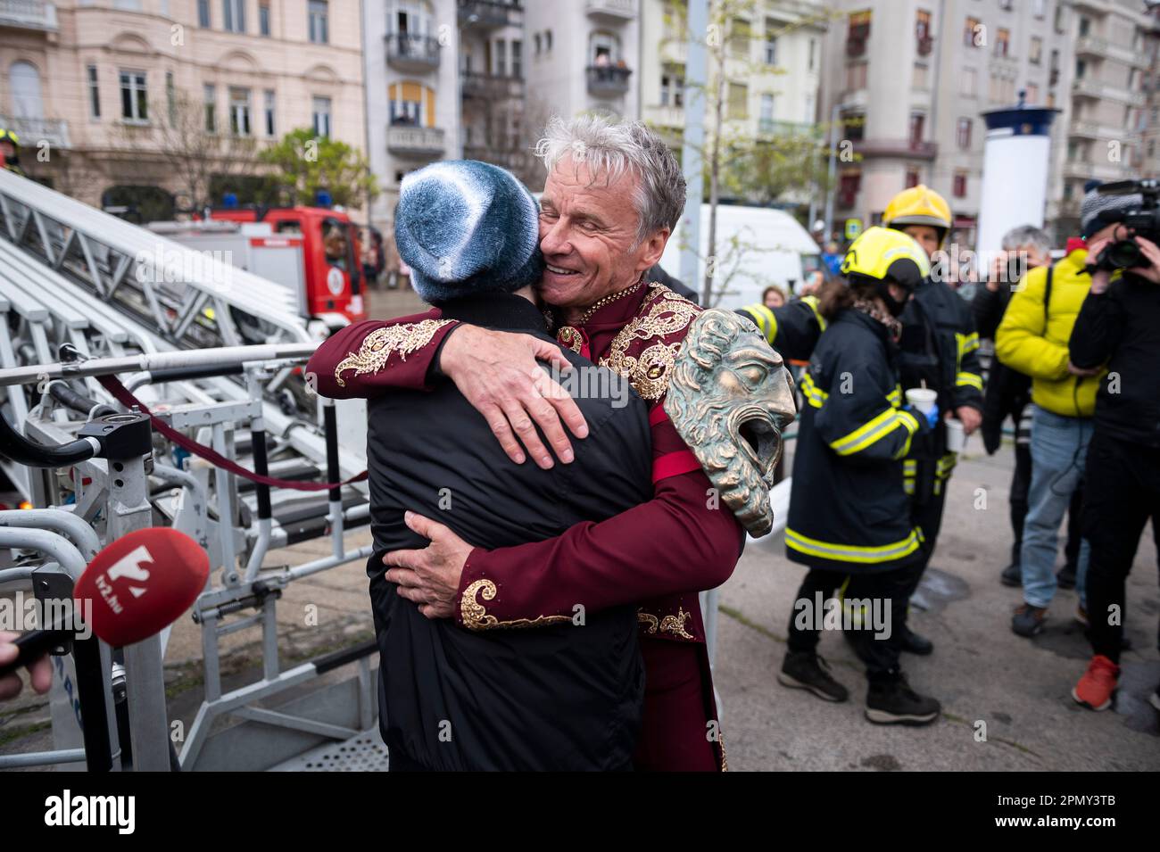63-year-old circus artist Laszlo Simet hugs a relative after walking on ...