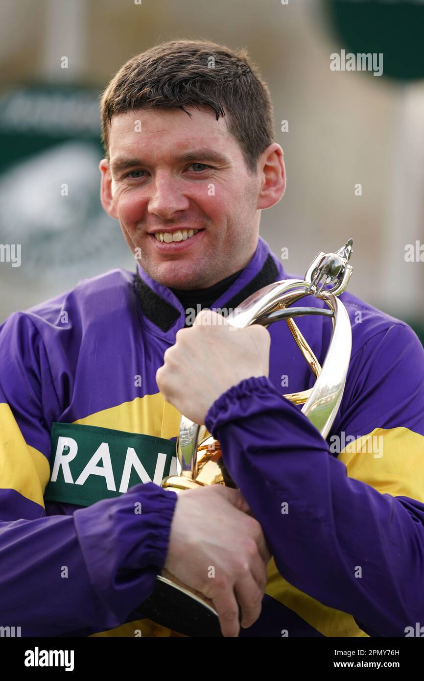 Derek Fox poses with the trophy after winning the Randox Grand National Handicap Chase on Corach ...