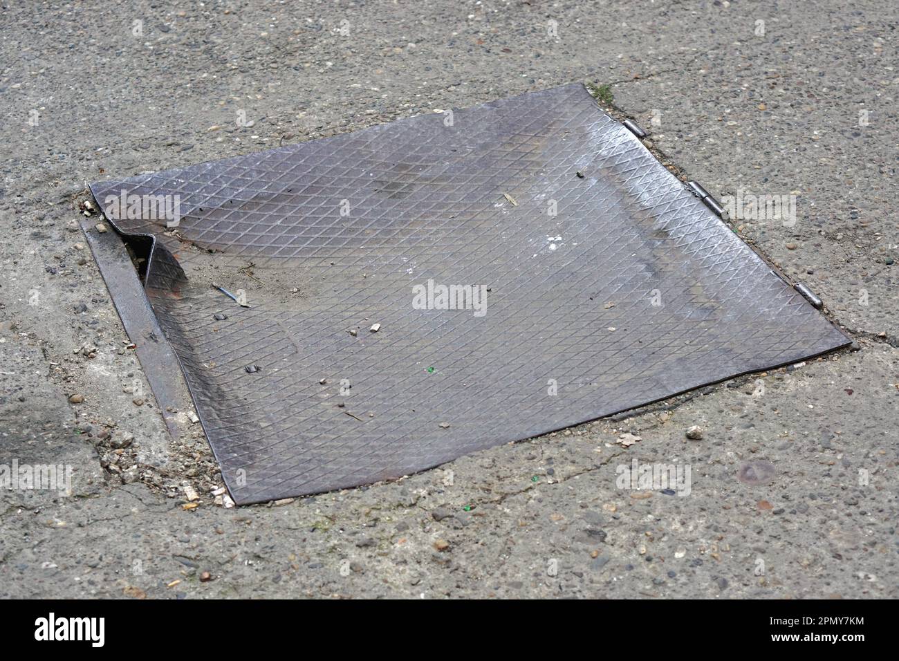 Broken manhole cover hi-res stock photography and images - Alamy