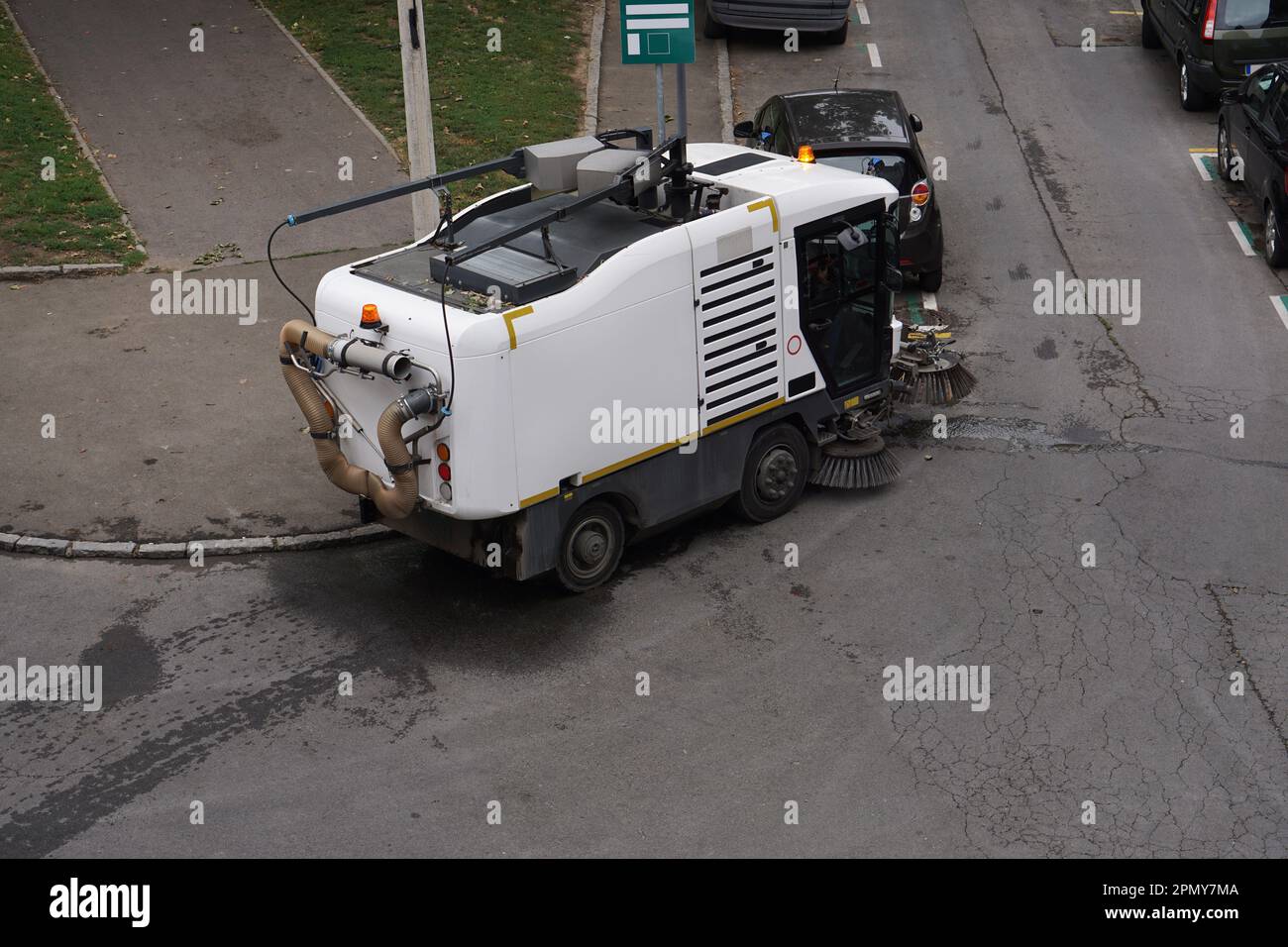 Street sweeper vehicle cleaning machine in city Stock Photo - Alamy