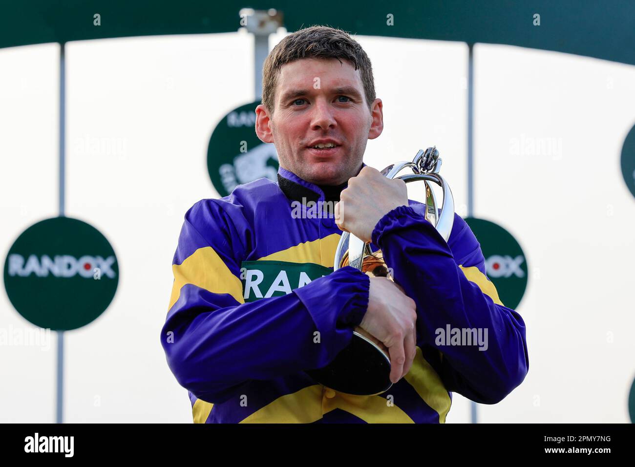 Derek Fox the Grand National winning jockey with the race trophy at The Randox Grand National ...