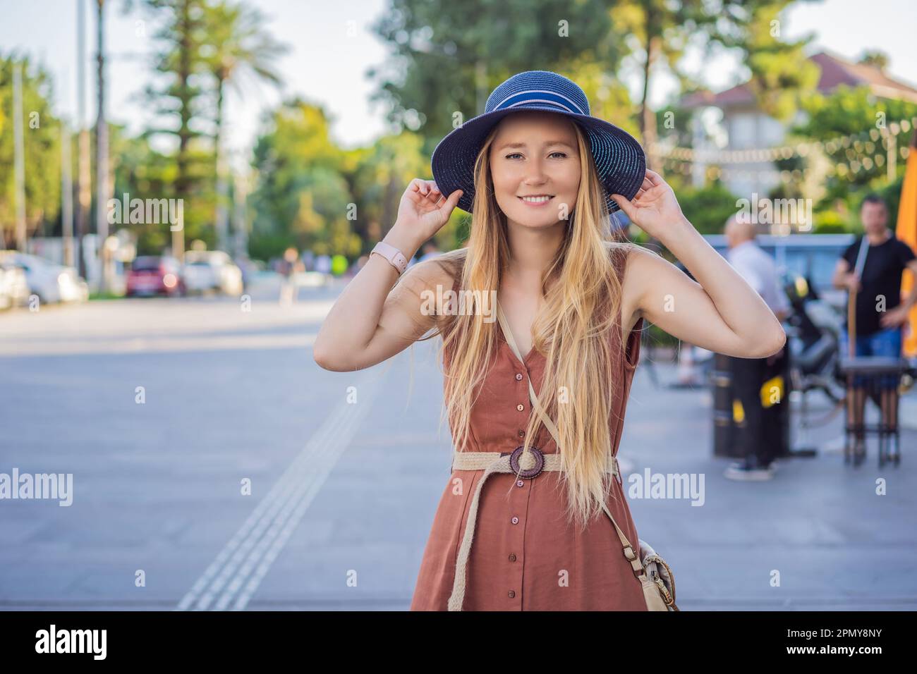 Happy woman tourist on background of old street of Antalya. female ...