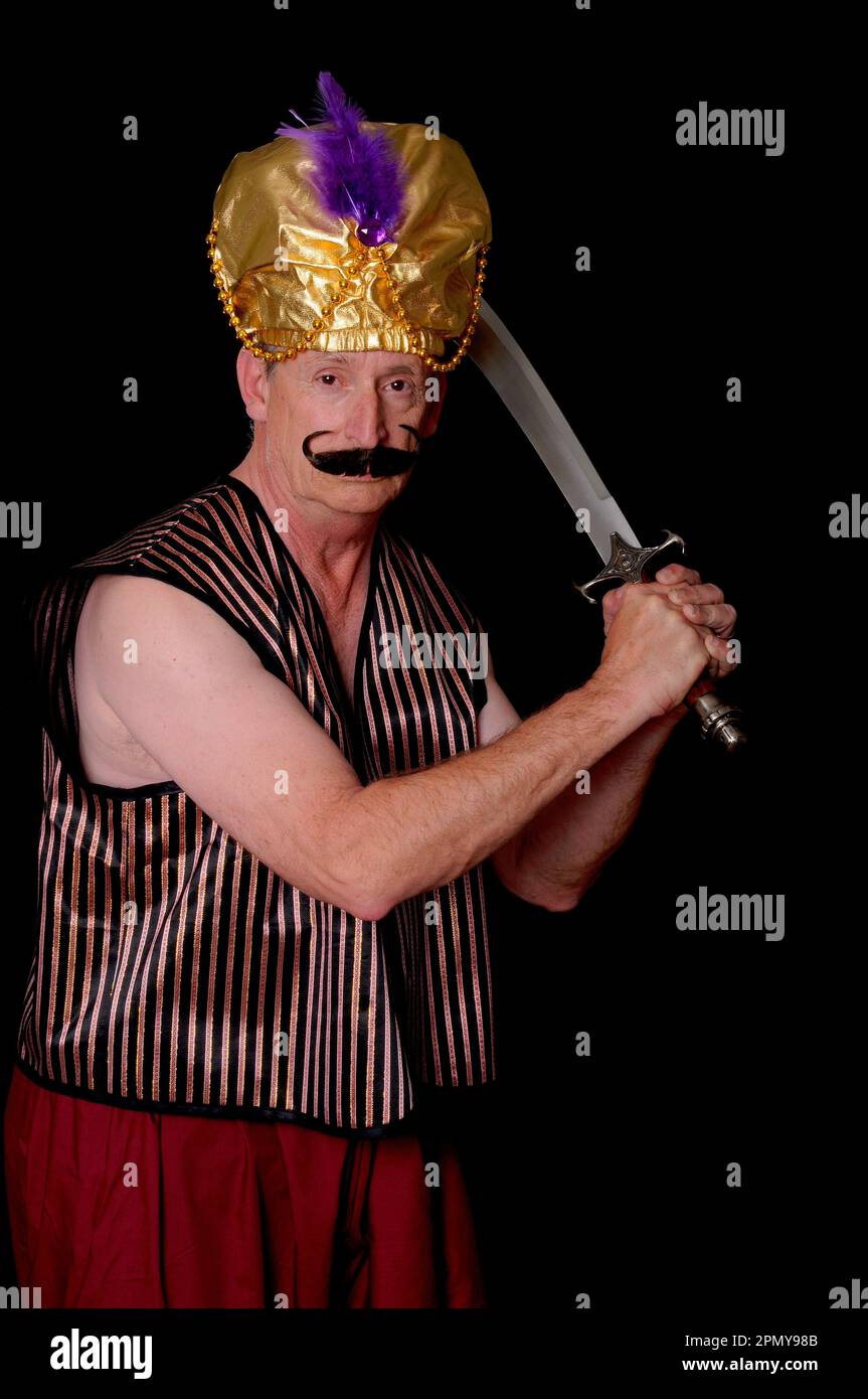 An elder sultan or sheik isolated over black Stock Photo - Alamy