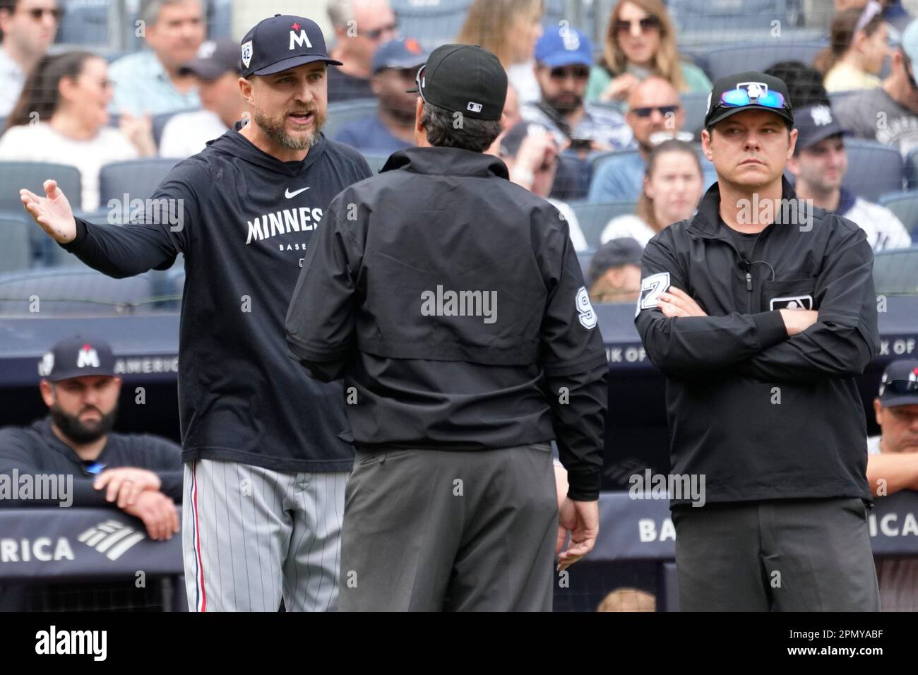 Minnesota Twins manager Rocco Baldelli, left, argues with umpire James ...