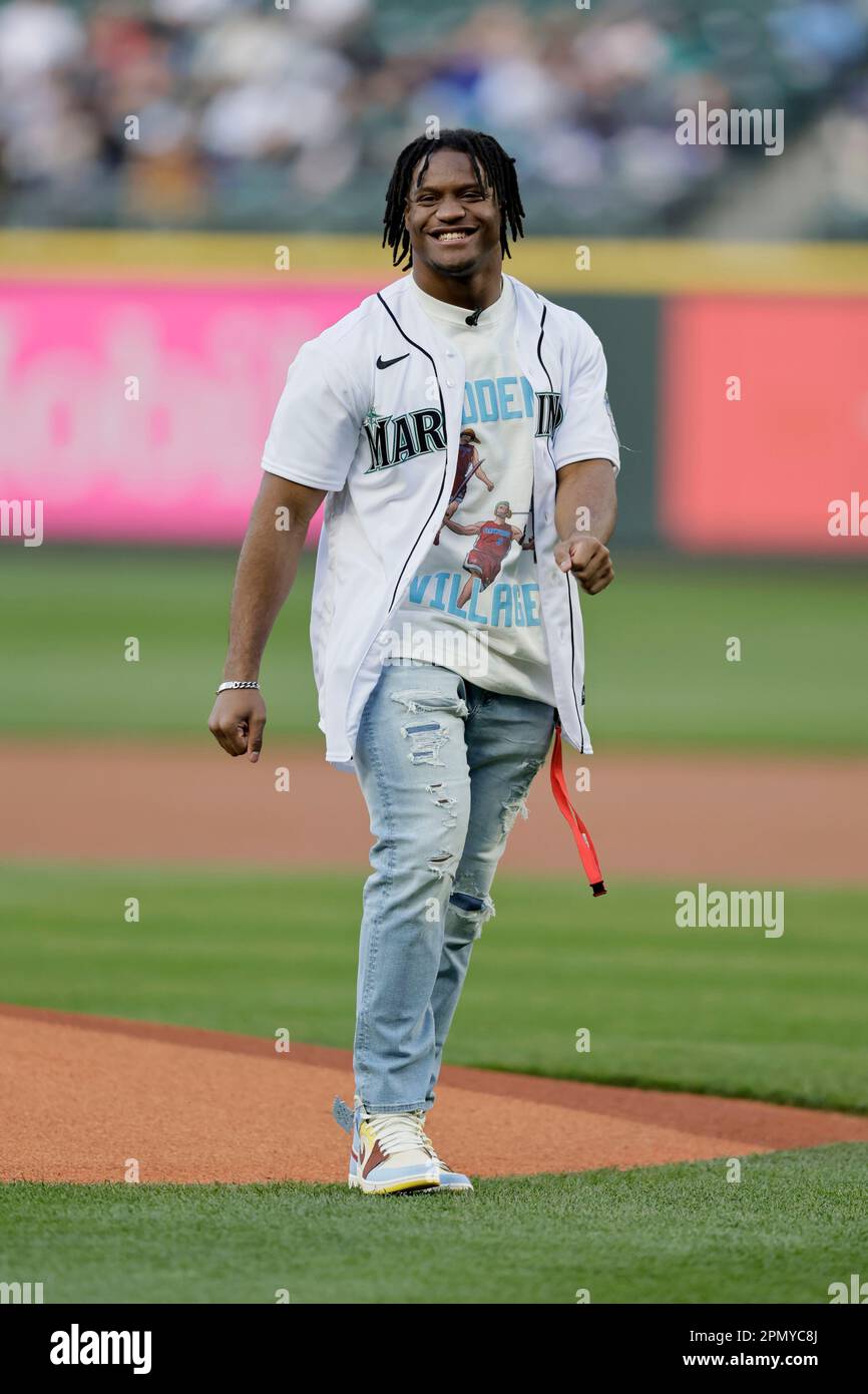 Seattle Seahawks running back Kenneth Walker III smiles as he walks off ...
