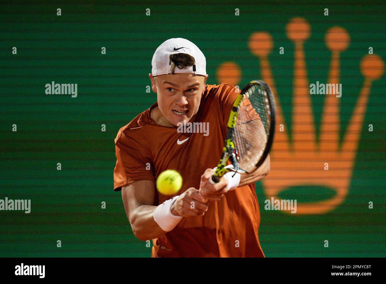 Holger Rune, of Denmark, returns the ball to Jannik Sinner, of Italy, during their Monte Carlo ...