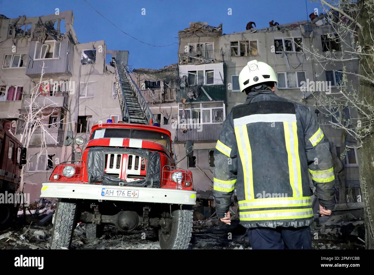 SLOVIANSK, UKRAINE - APRIL 14, 2023 - A rescuer stands by a fire engine ...