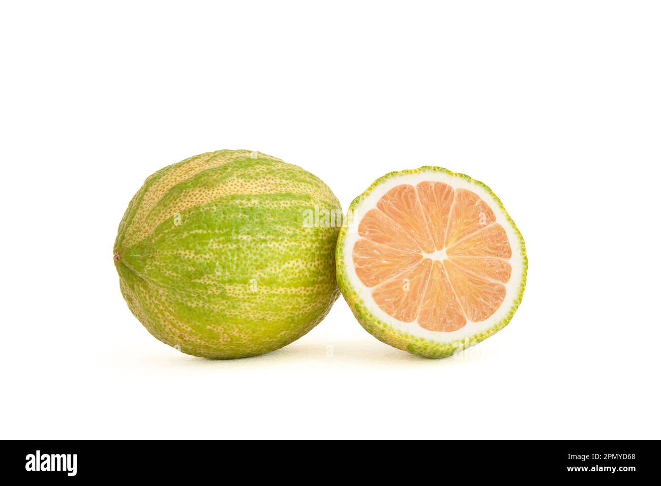 Close-up of pink lemons with stripes on a white background Stock Photo ...