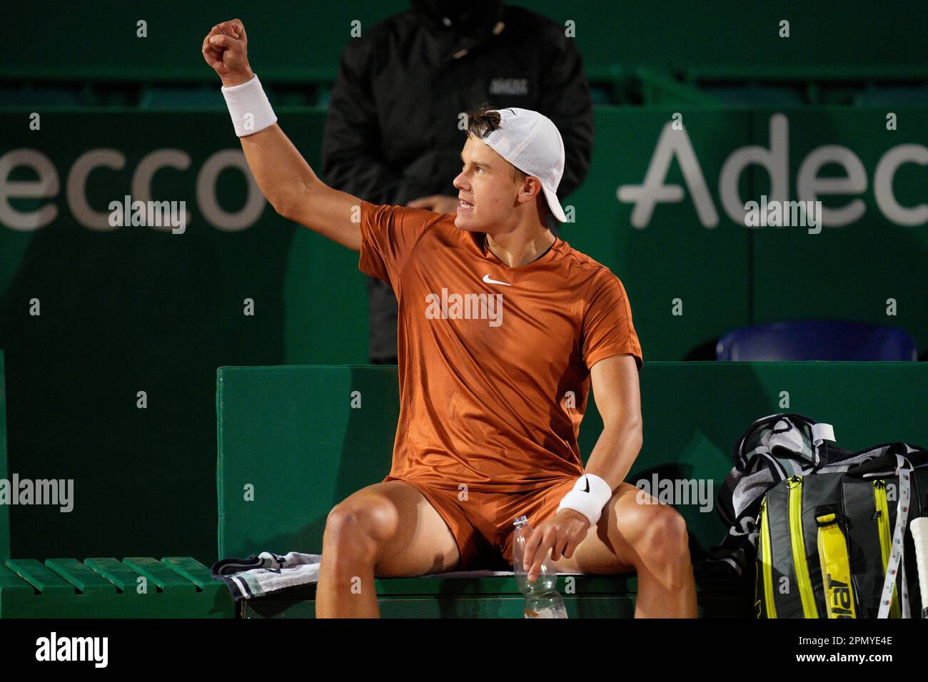 Holger Rune, of Denmark, gestures from the bench while playing Jannik Sinner, of Italy, in their ...