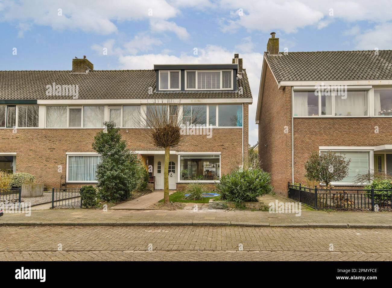 some houses that are in front of each other buildings and one has a car ...