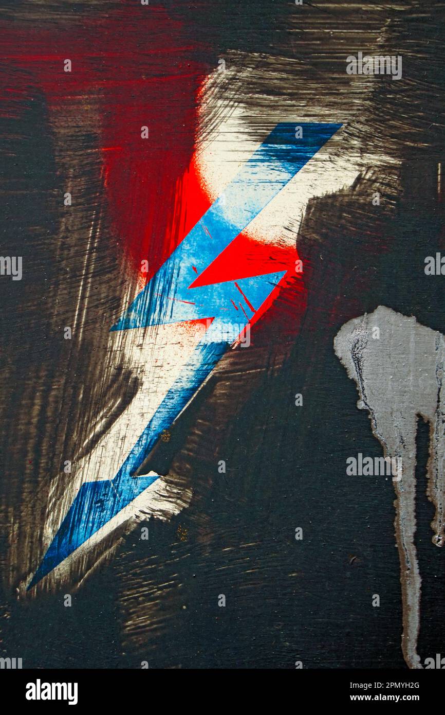 electricity symbol blue paint on grunge wall Stock Photo - Alamy