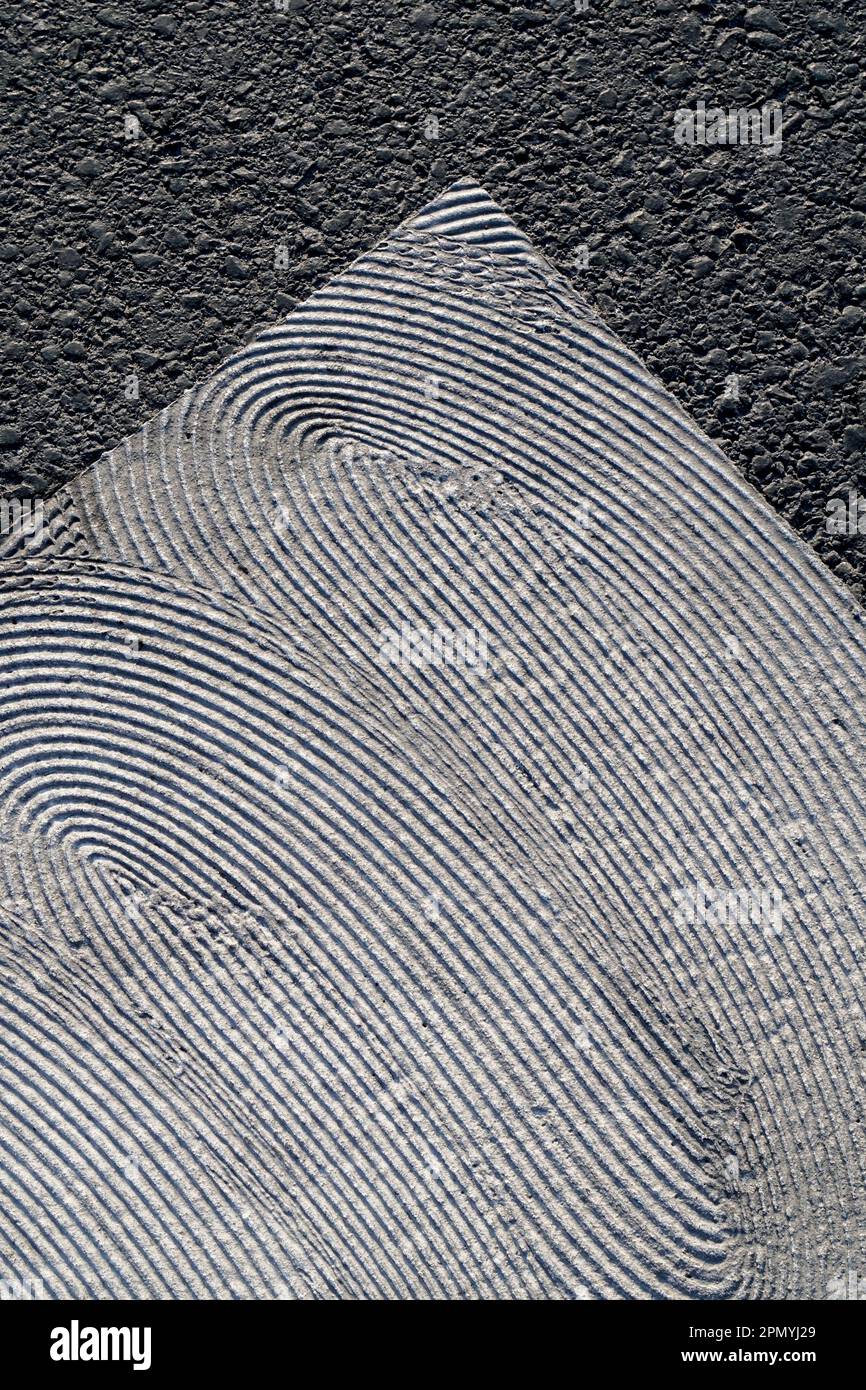 geometrical white painting of pedestrian crossing with texture on ...