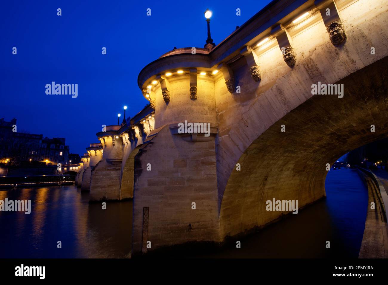 CItyscape of downtown with Pont Neuf Bridge and River Seine at night ...