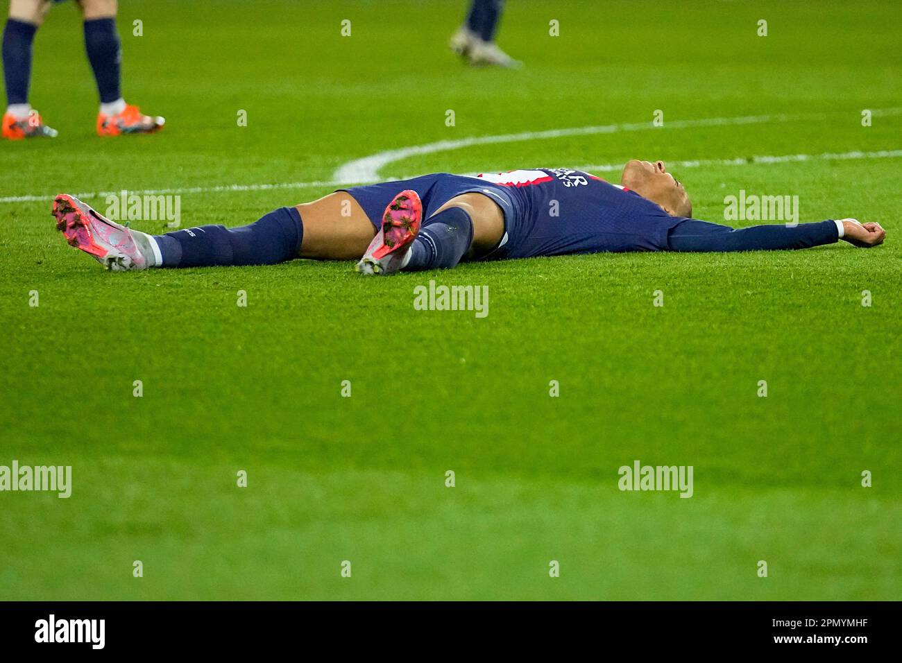 PSG's Kylian Mbappe lies on the pitch during the French League One ...