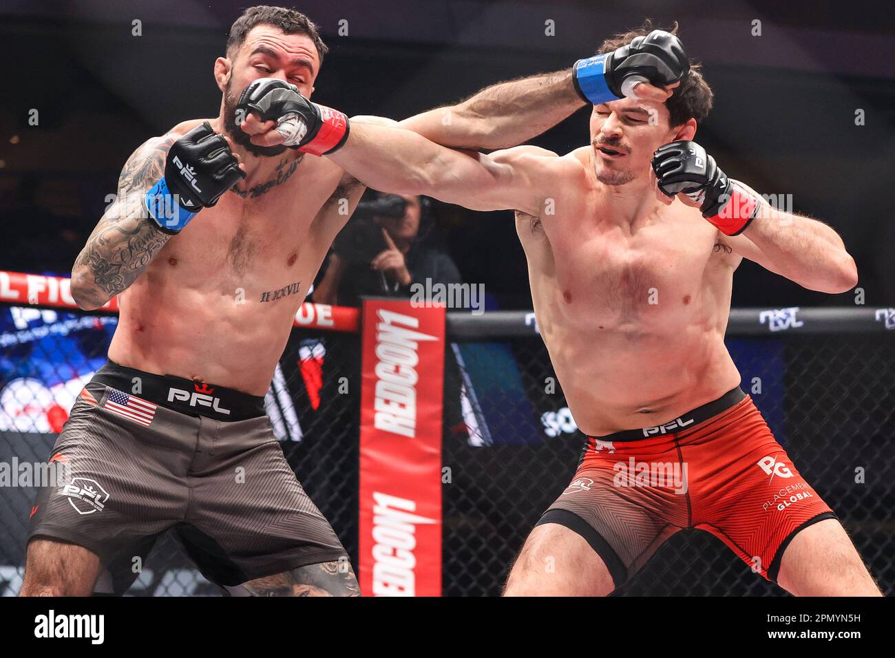 April 14, 2023: (R-L) Lightweight Olivier Aubin-Mercier and Shane Burgos exchange punches during ...