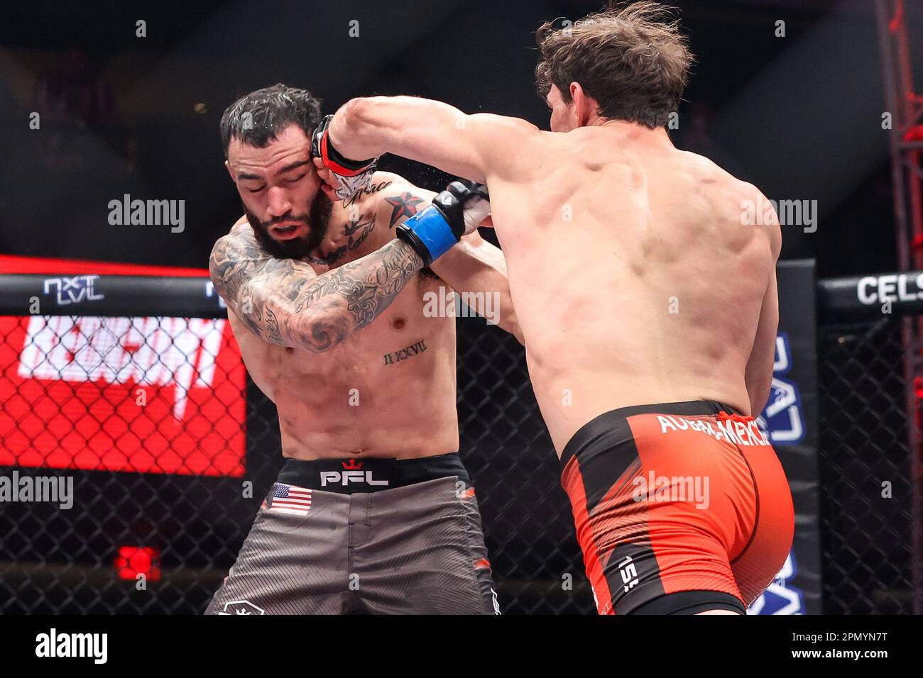 April 14, 2023: (R-L) Lightweight Olivier Aubin-Mercier punches Shane Burgos during the PFL 3 ...