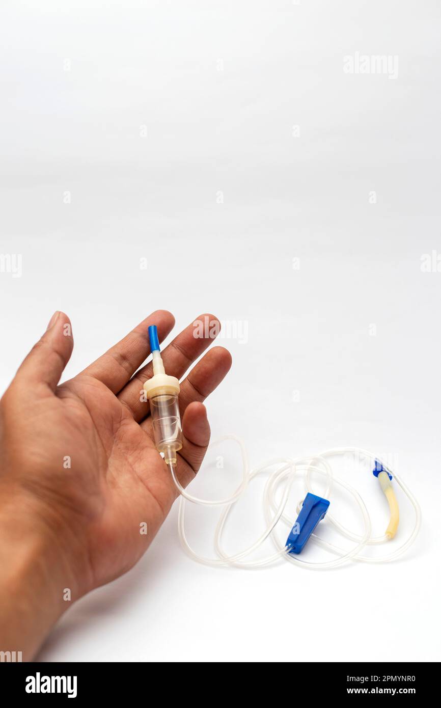 IV Infusion Set with Needle in hand Stock Photo - Alamy