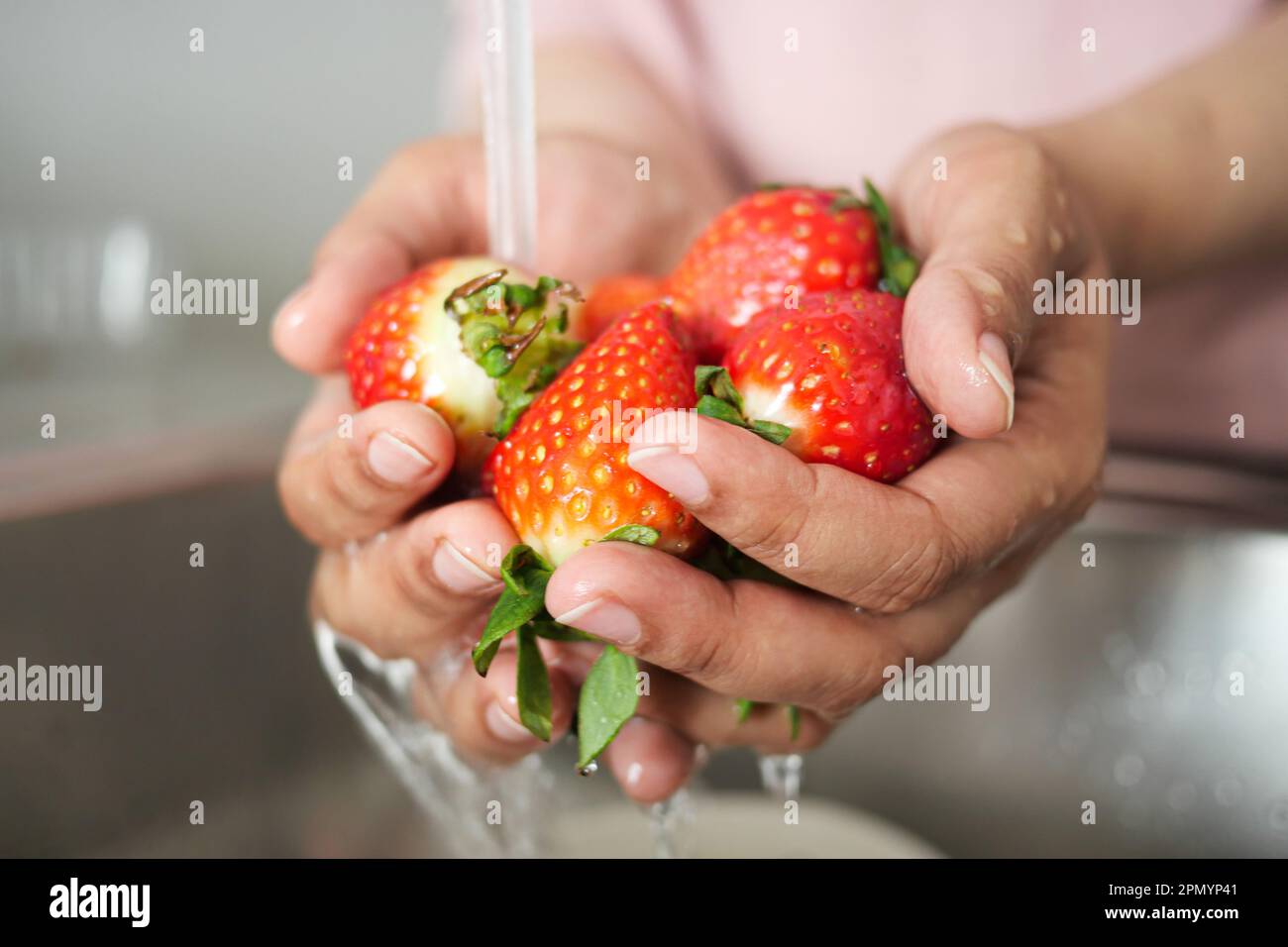 fresh strawberry washing with hand Stock Photo - Alamy