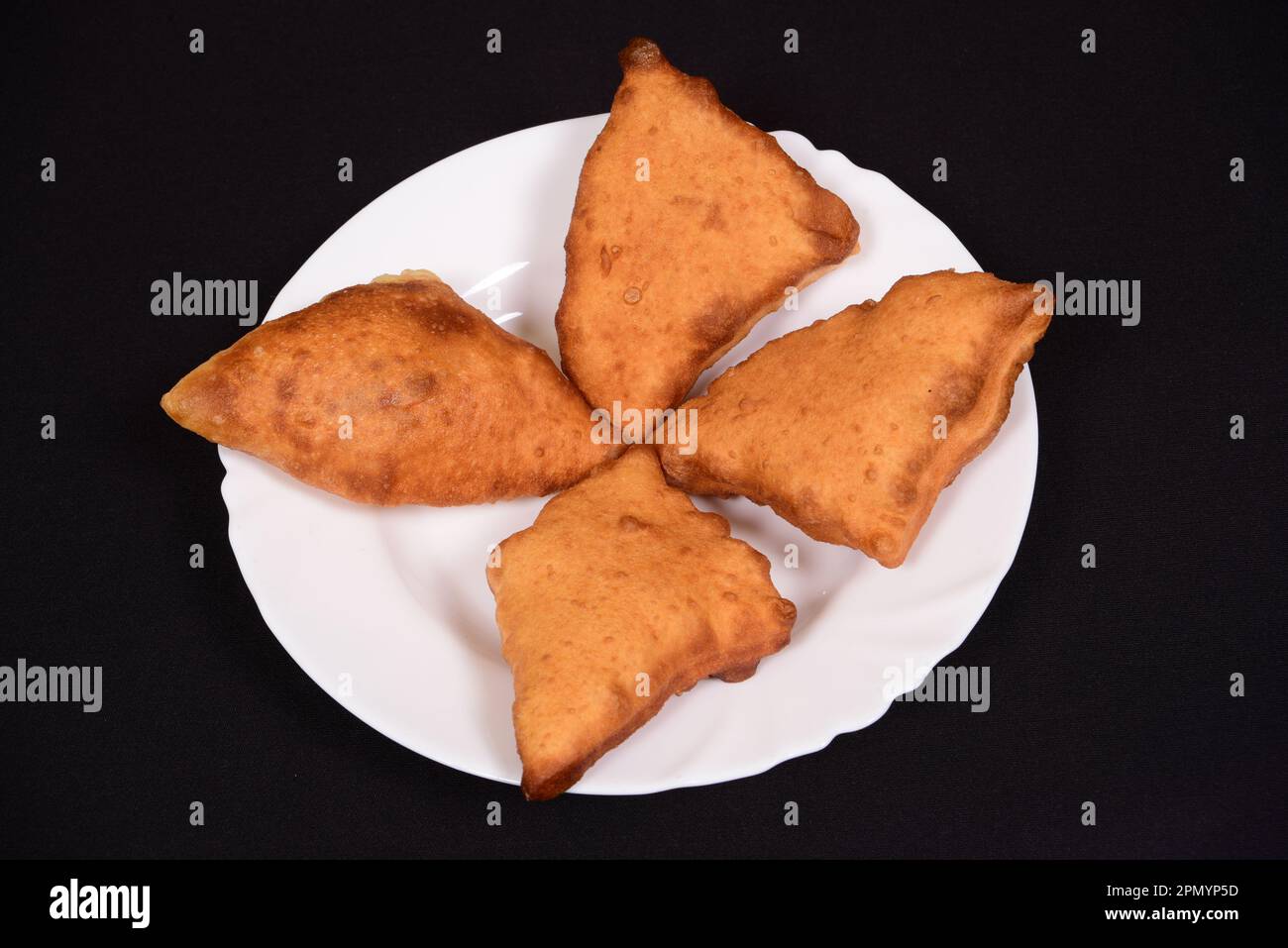 African doughnut "Mandazi" soft and tasty on an isolated background ...